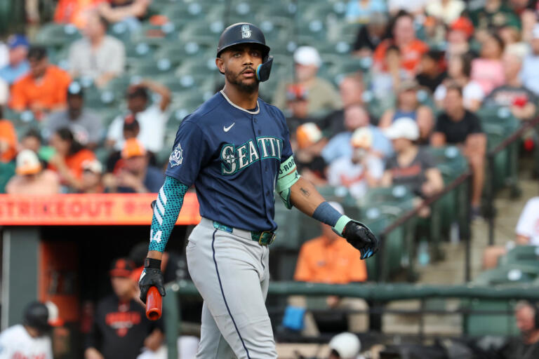 Holliday hits grand slam and Young pitches Orioles past Mariners 7-2 to ...